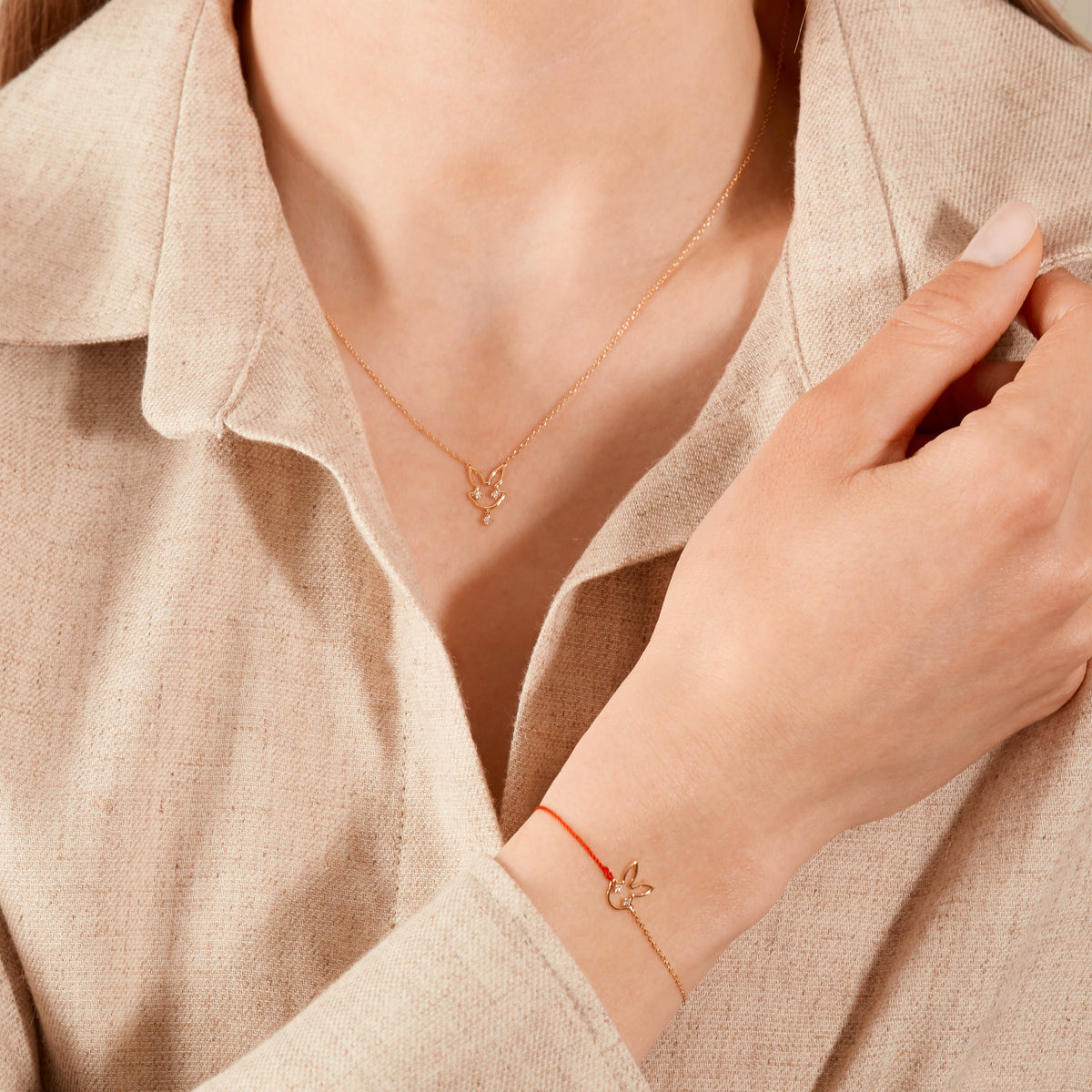 Ruifier 18ct yellow gold Scintilla Rabbit red cord and chain bracelet ...